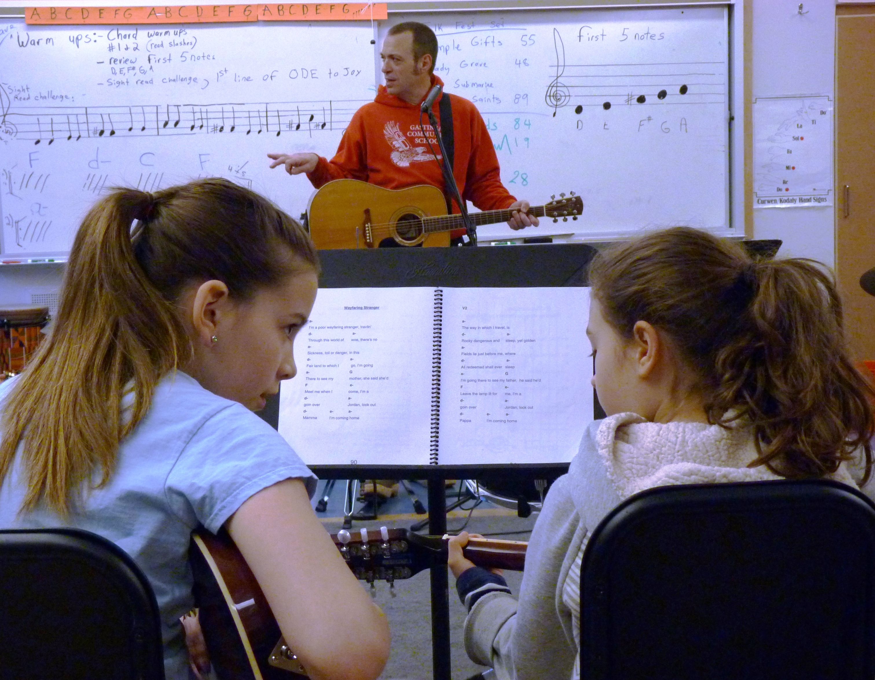 Kids learn folk songs, instruments in elementary school class
