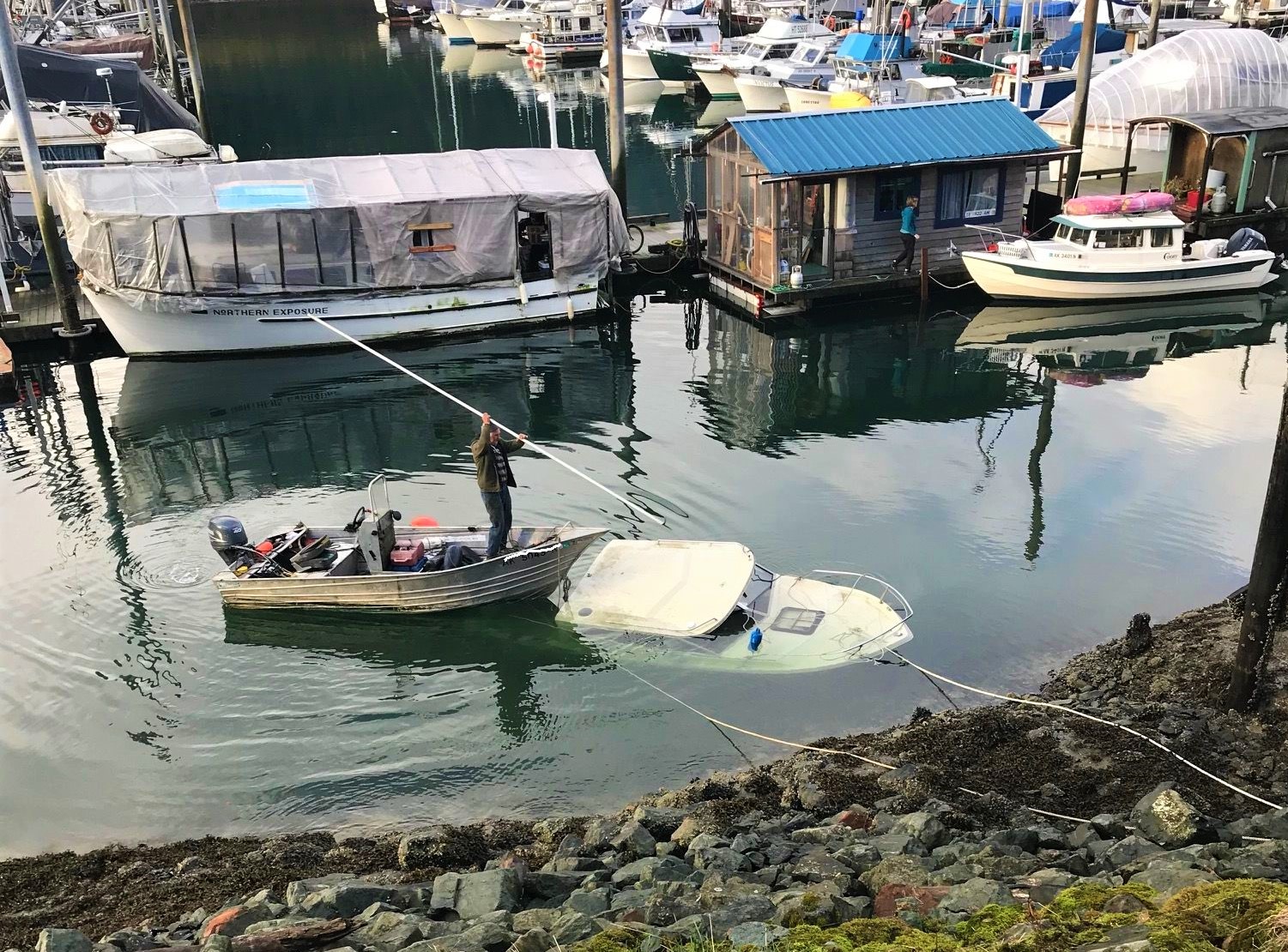 Boat recovered after sinking in Harris Harbor