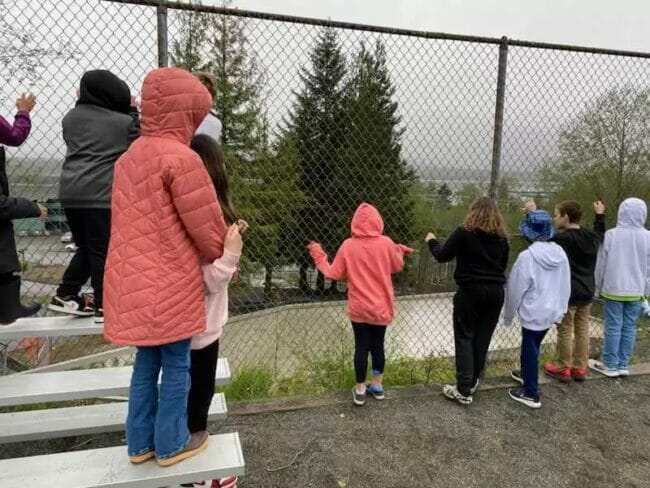 Ketchikan students look to the sky for Crystal Worl’s salmon formline plane