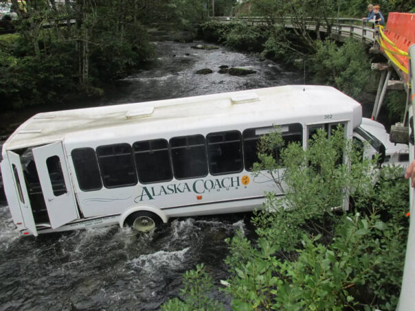 None hurt as tour bus plunges into Ketchikan Creek