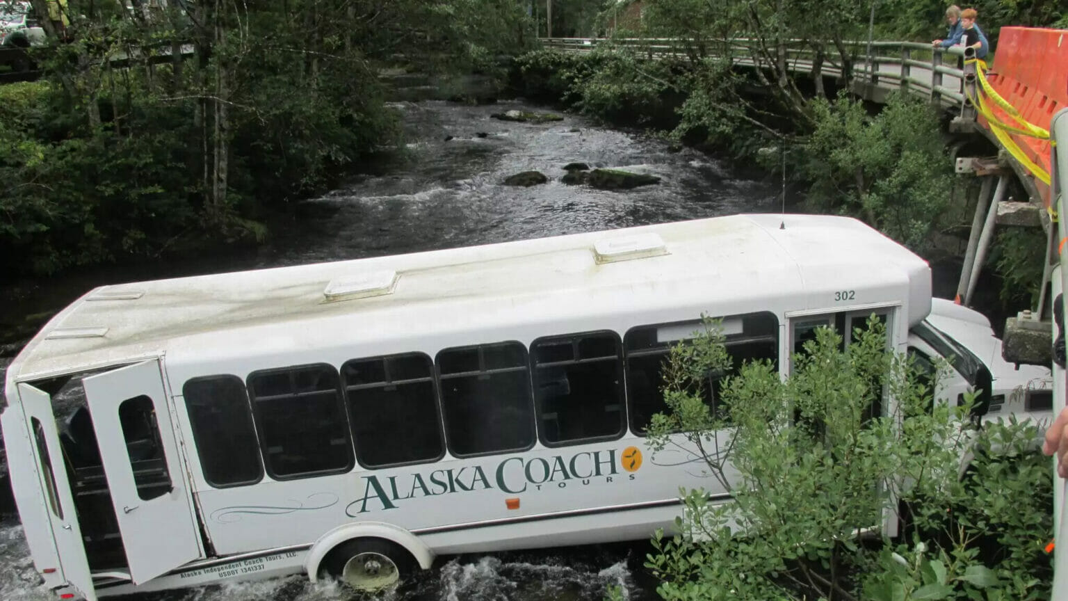 None hurt as tour bus plunges into Ketchikan Creek