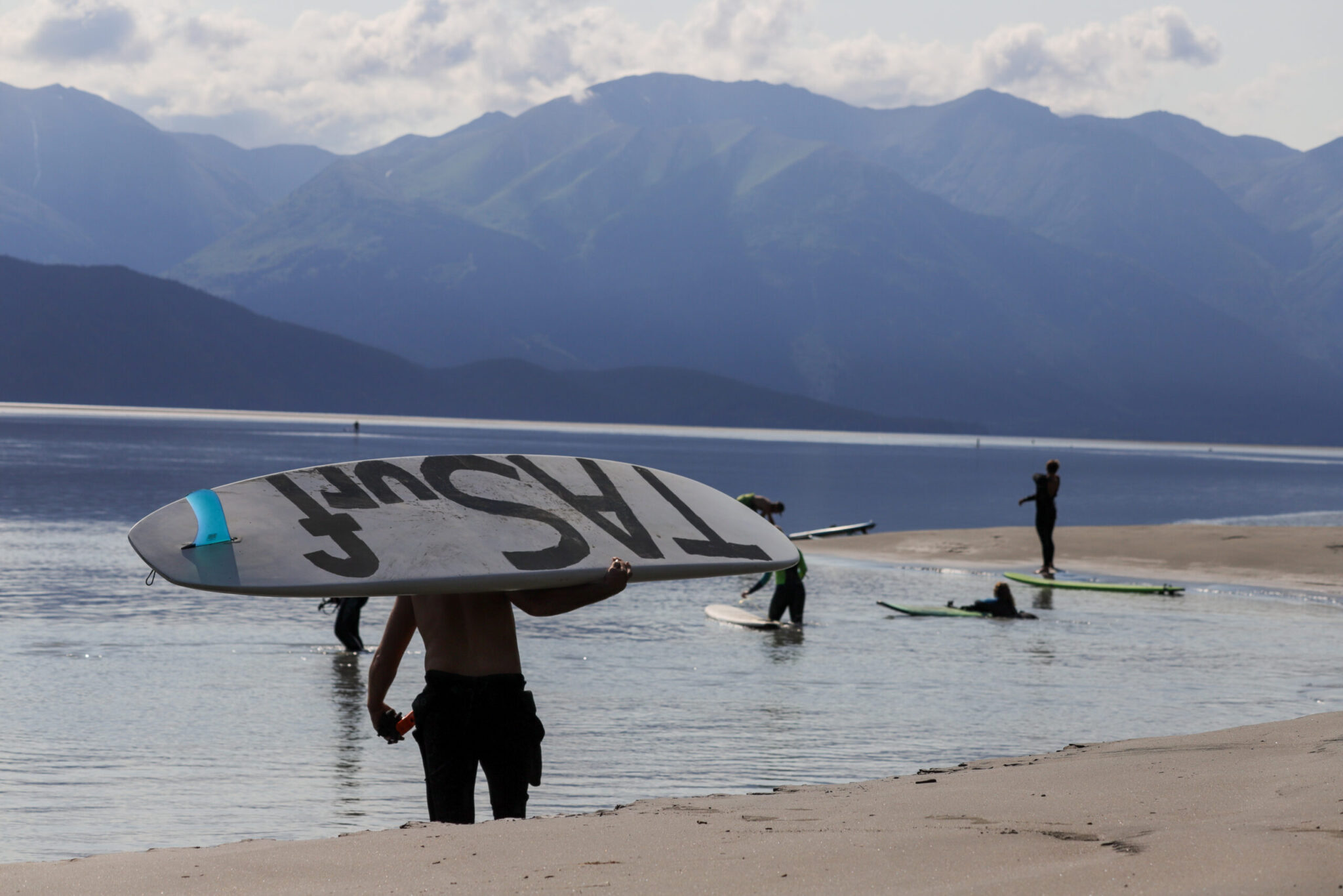 Surfers in Turnagain Arm catch the country’s longest wave: 'It's trippy'